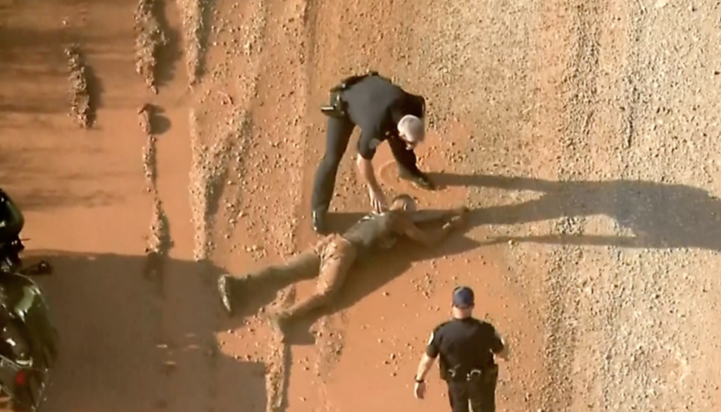 Handcuffed suspect lands in muddy water after high-speed chase on ...